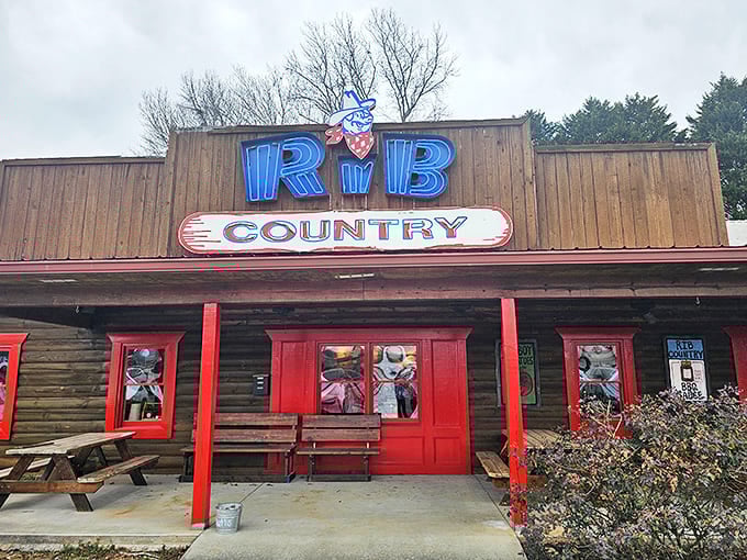 The neon glow of Rib Country's sign promises smoky delights within those rustic wooden walls. BBQ paradise found!