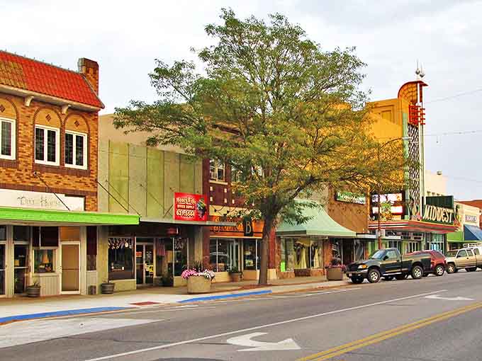 Downtown Scottsbluff's colorful storefronts and historic theater marquee create a Norman Rockwell painting come to life.