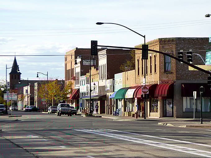 Historic downtown Winslow showcases charming brick buildings with colorful awnings, a perfect backdrop for your Route 66 retirement dreams.