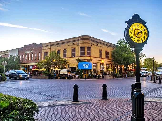 Winters' town square at dusk, where that charming clock tower stands sentinel over brick buildings that whisper stories of simpler times.