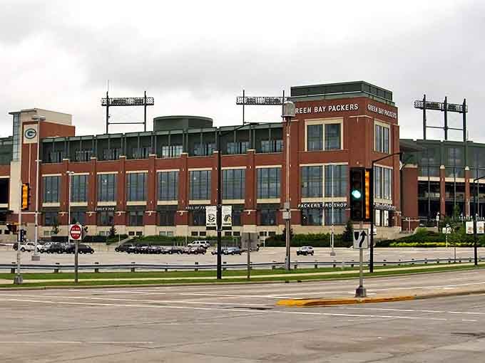 Lambeau Field stands like a cathedral to football dreams. In Green Bay, you can afford both season tickets AND a mortgage!