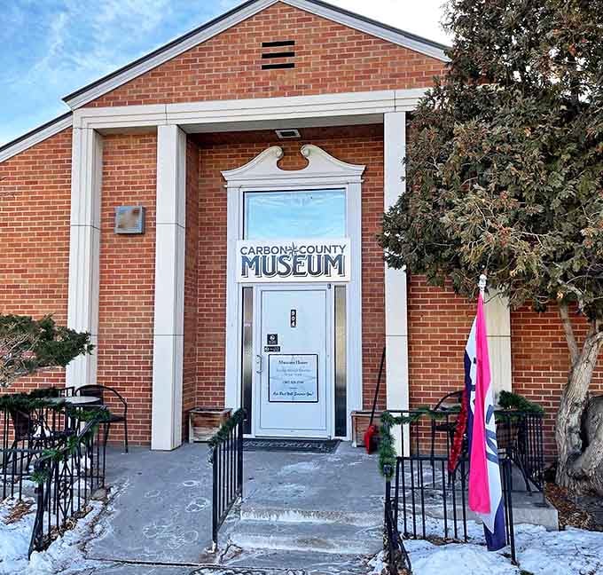 The Carbon County Museum invites visitors to step back in time, its brick facade and welcoming entrance promising stories of Wyoming's colorful past.