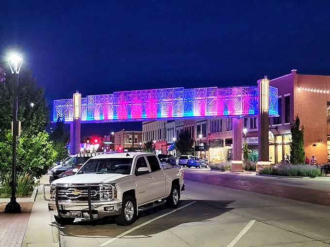 By night, downtown's illuminated walkway transforms into a neon celebration that feels like small-town Kansas giving Times Square a run for its money.