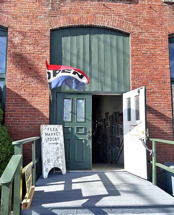 The unassuming entrance says it all&mdash;weathered sign, brick facade, and that magical "OPEN" flag that promises adventure awaits inside.