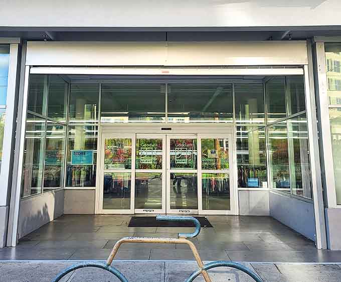 The gateway to bargain bliss. These unassuming glass doors might as well be portals to a parallel universe where designer labels cost less than your morning coffee.