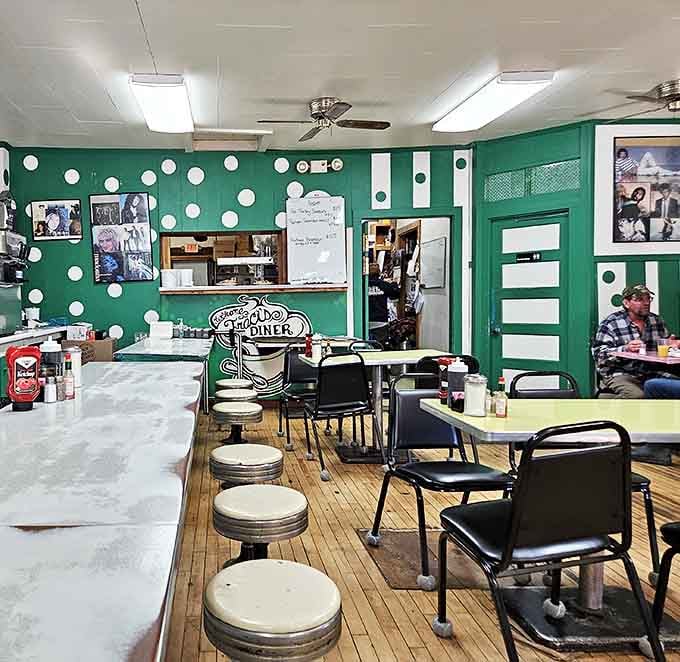 Step inside to a sea of cheerful green walls adorned with polka dots, where counter stools await your elbows and breakfast dreams.