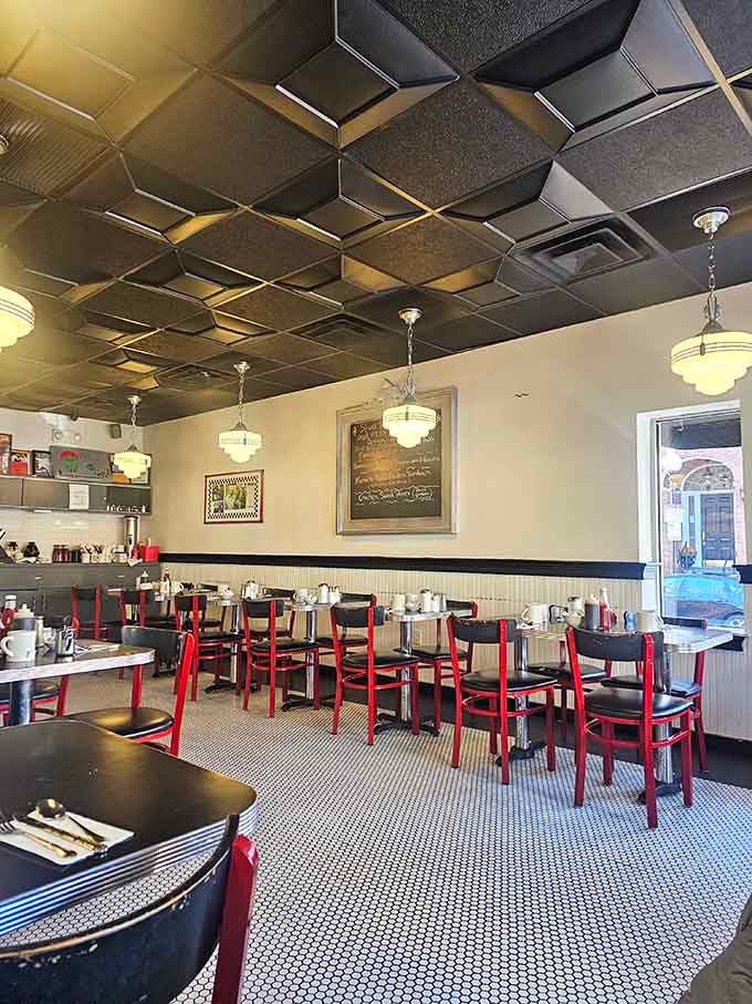 Classic diner aesthetics done right&mdash;metallic ceiling tiles, pendant lights, and those red-framed chairs that have supported generations of satisfied Bostonians.