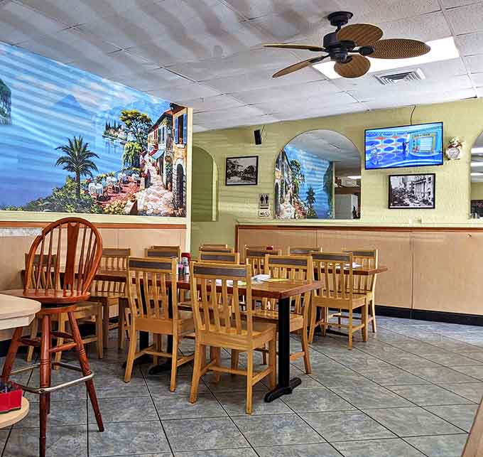 Wooden chairs, ceiling fans, and a Mediterranean mural create the perfect unpretentious backdrop for morning conversations that flow as freely as the coffee.