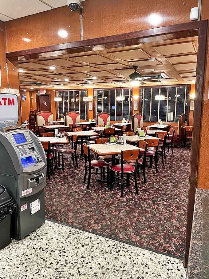That carpet pattern has witnessed more breakfast debates and coffee refills than most marriage counselors. Classic diner comfort in every corner.