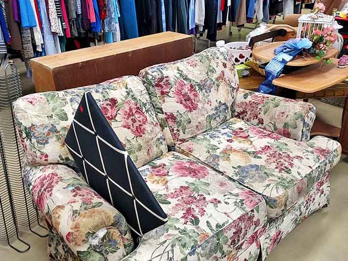 Grandma's floral sofa gets a second chance! This vintage loveseat waits patiently for someone who appreciates retro charm and comfortable seating.