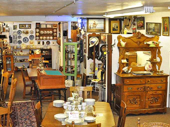Oak dressers with stories to tell stand sentinel among fine china and glassware. Each piece whispers tales of Sunday dinners past.