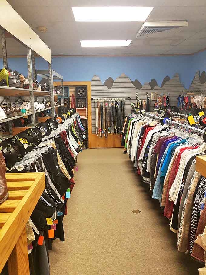 Organized chaos at its finest! Racks of carefully arranged clothing create a rainbow road of fashion possibilities, each hanger a potential style revelation.