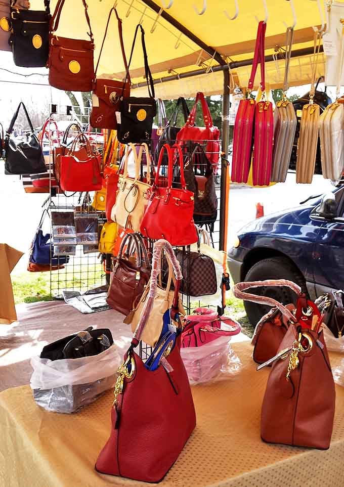 A rainbow of handbags dangles like ripe fruit, each one whispering promises of being "the perfect one" you didn't know you needed.