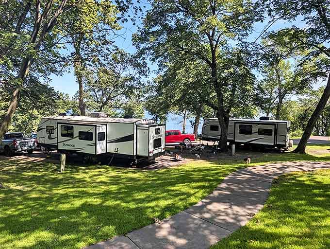 Camping nirvana: RVs nestled among trees with lake views just steps away. The definition of "roughing it comfortably."