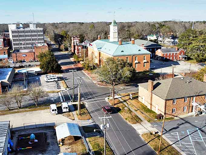 A bird's-eye view of downtown Tarboro reveals its architectural diversity. The copper-topped church steeple stands as a beacon among brick buildings.