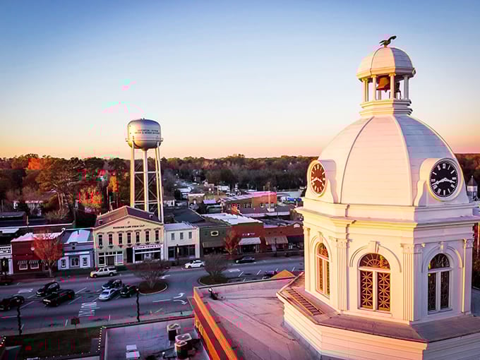 The iconic courthouse dome glows at sunset, standing sentinel over Eatonton like a Southern beacon calling weary travelers home.