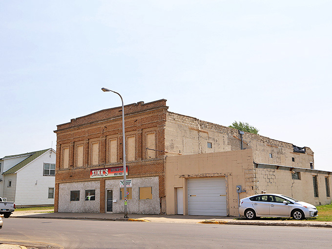 Time seems to stand still at Zink's, where the weathered brick exterior serves as a reminder that some places earn their character honestly.