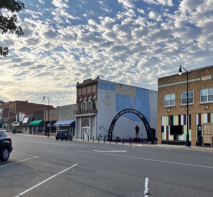 Perry's skyline unfolds beneath a tapestry of cotton-candy clouds, showcasing the town's blend of preserved history and modern spirit.
