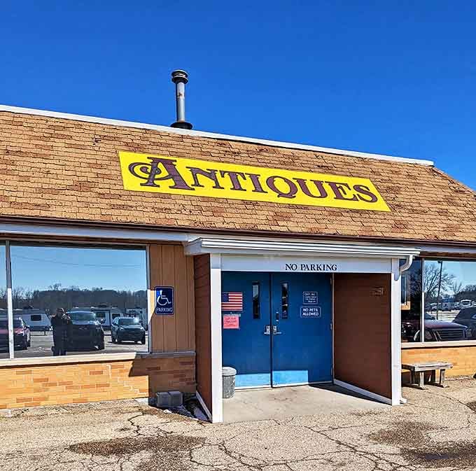 The siren call of treasure hunters everywhere—that bold yellow "ANTIQUES" sign might as well say "Adventure Starts Here."
