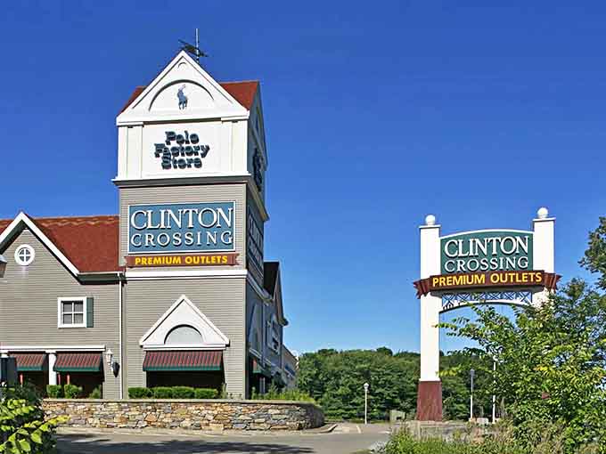 The iconic Clinton Crossing Premium Outlets entrance, where New England charm meets retail therapy. That Polo Ralph Lauren sign is basically a lighthouse guiding shoppers to fashion salvation.