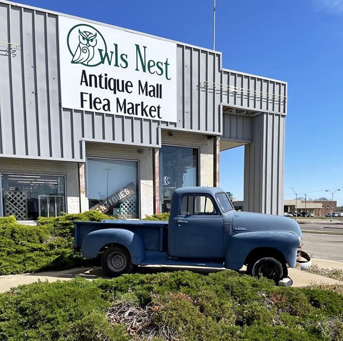 The classic mid-century sign and blue pickup create the perfect antiquing prelude, like the opening credits to your own personal treasure hunt.