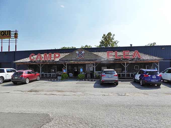 The rustic cabin-inspired facade of Camp Flea beckons with its bold red lettering, promising adventures in antiquing that'll fill your backseat without emptying your wallet.