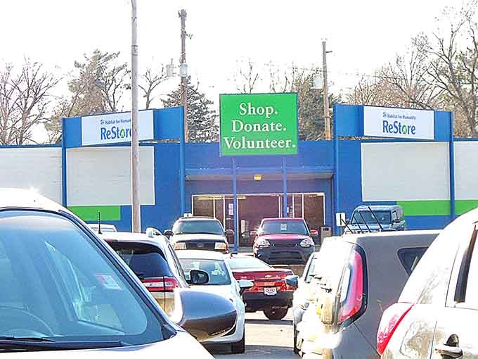 The blue and green facade boldly announces its triple mission: "Shop. Donate. Volunteer." A busy parking lot signals you've found Lincoln's worst-kept secret.