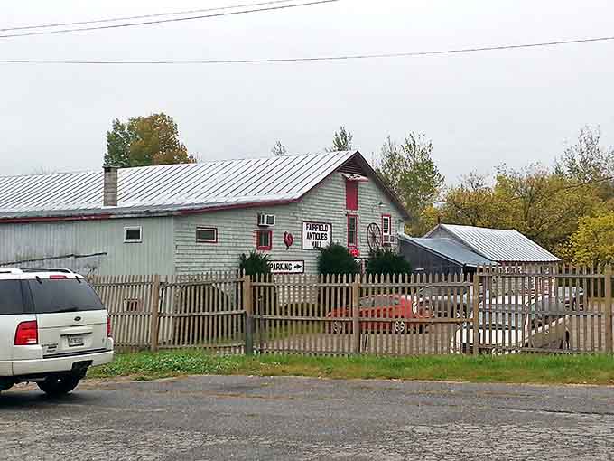 Even from the road, the vintage wagon wheel and rustic fence hint at the historical bounty awaiting inside this unassuming time capsule.