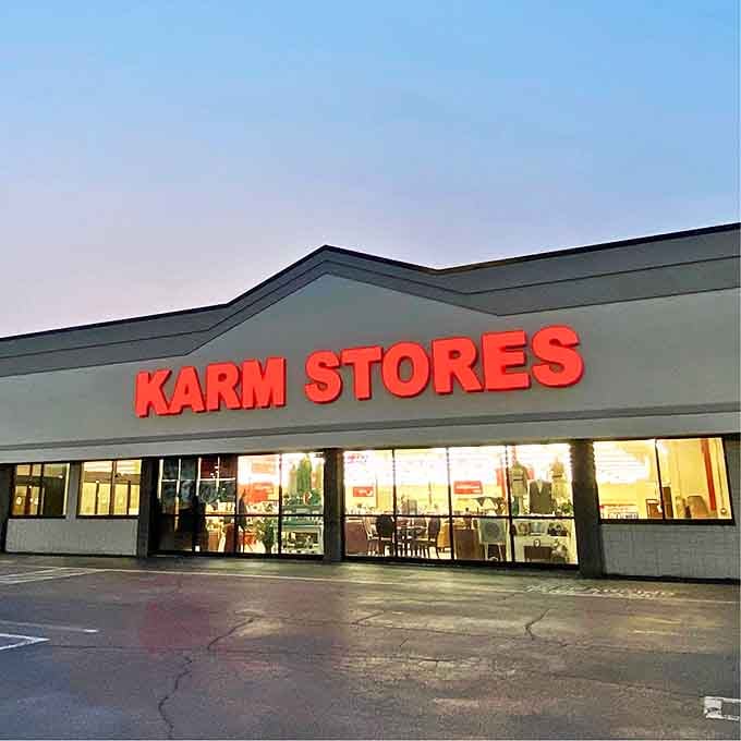 As dusk settles, those glowing red letters become a beacon for bargain hunters. The thrift store equivalent of "Open Sesame" for your wallet.
