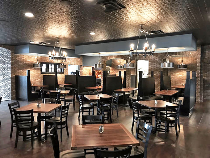Where rustic meets refined &ndash; exposed brick walls, pressed tin ceilings, and comfortable booths create the perfect backdrop for serious eating without pretension.