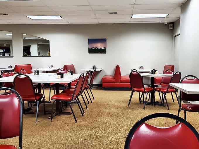 Red vinyl chairs and simple white tables create the perfect backdrop for breakfast drama to unfold. No designer needed when the food's this good.