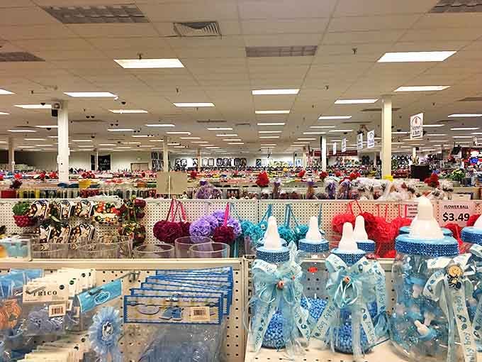 A fluorescent-lit wonderland stretches to the horizon, where party supplies and seasonal decorations await budget-conscious celebrators with open arms.