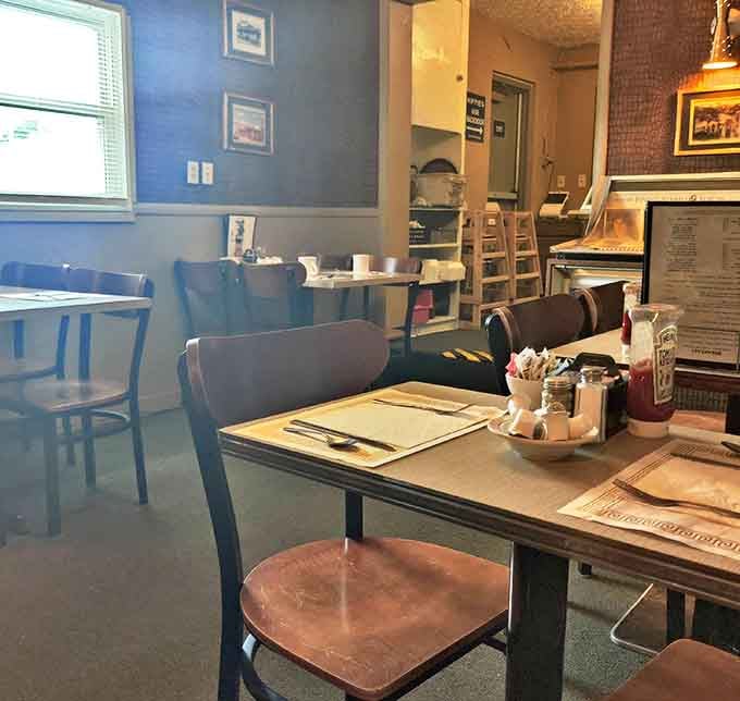 The classic blue walls and well-worn wooden chairs create that perfect diner atmosphere where conversations flow as freely as the coffee.