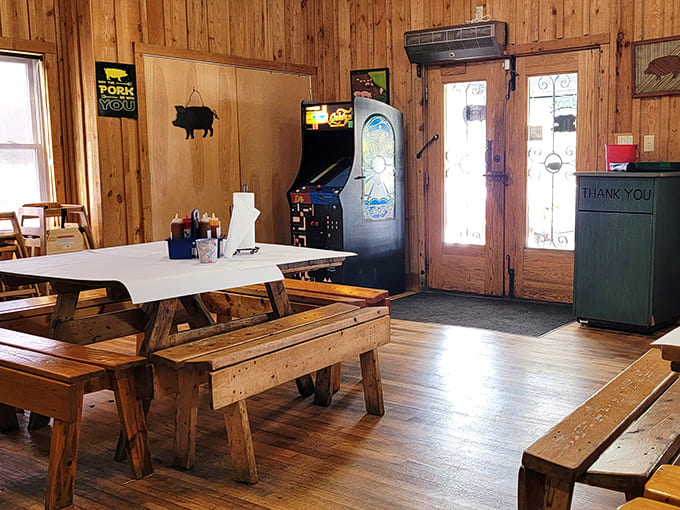 Wooden walls that have absorbed years of smoky goodness create the perfect backdrop for serious eating. That arcade game? Dessert for the kids.