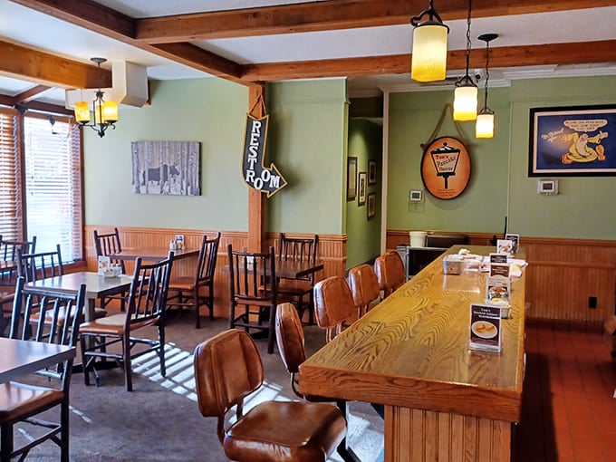 Warm wood paneling, pendant lighting, and that inviting counter&mdash;this isn't just a restaurant, it's breakfast therapy in architectural form.