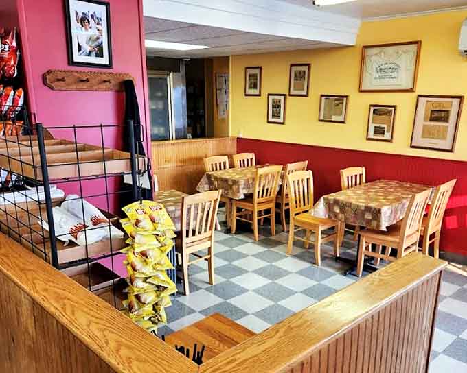Red walls, yellow accents, and wooden chairs create the perfect no-frills atmosphere where conversations flow as freely as the coffee.