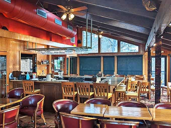 Wood paneling, exposed beams, and that unmistakable warm glow—this isn't just a dining room, it's Rhode Island's living room.