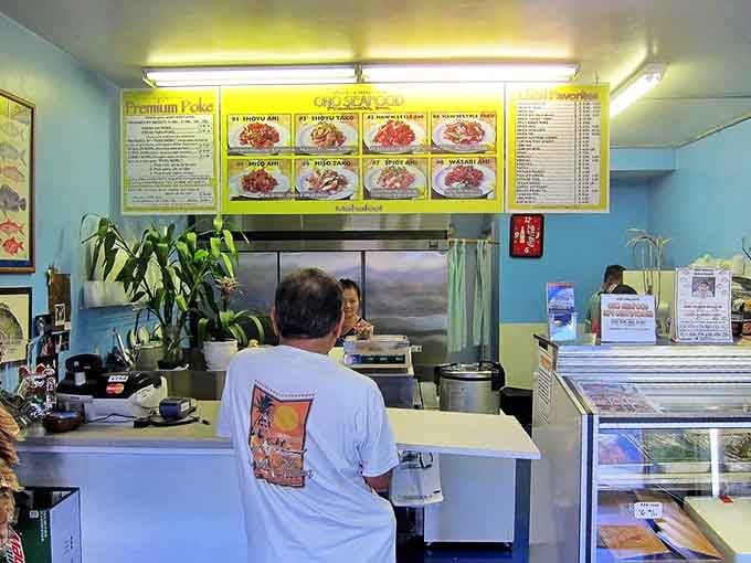 Inside this unassuming seafood sanctuary, the bright menu board showcases a rainbow of poke possibilities that will make your taste buds dance.