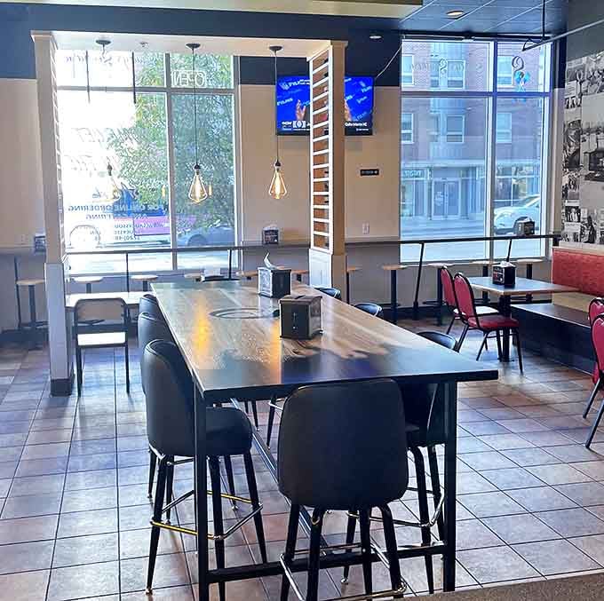 Modern meets comfort in this airy space. The high-top tables aren't just stylish&mdash;they're strategic for catching every savory aroma wafting through the room.