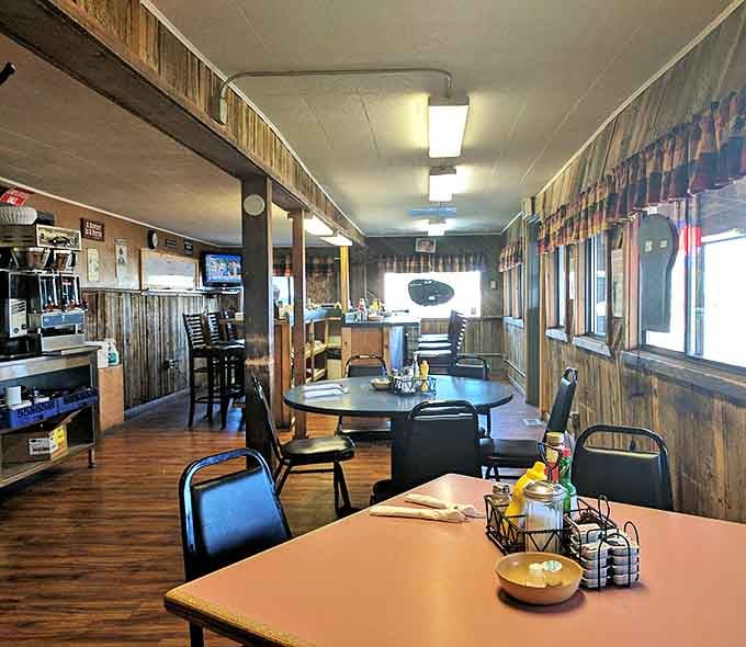 Inside, knotty pine paneling tells stories older than most chain restaurants, while simple tables promise something increasingly rare in America: authenticity without pretension.
