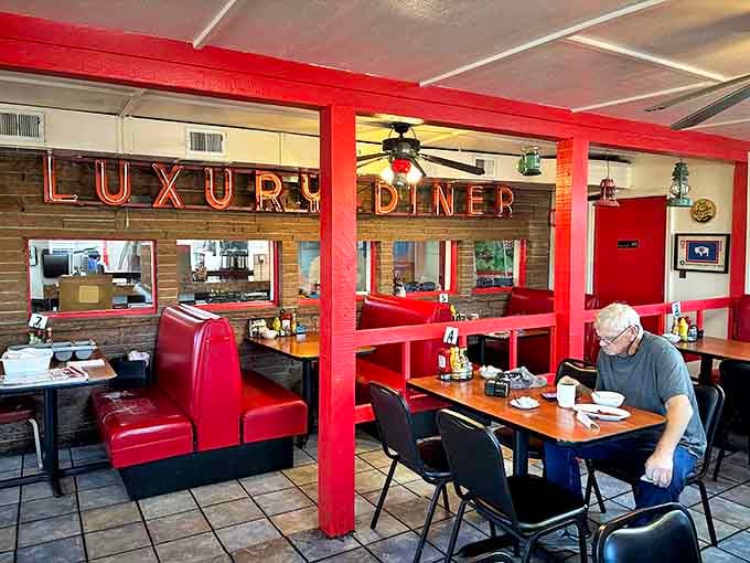 Classic red vinyl booths and neon signage create the perfect backdrop for breakfast magic. The diner's interior feels like a warm hug from a bygone era.