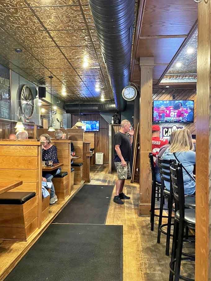 Vintage pressed tin ceilings crown wooden booths where comfort and conversation flow as freely as the draft beers. Hobbits would feel right at home.