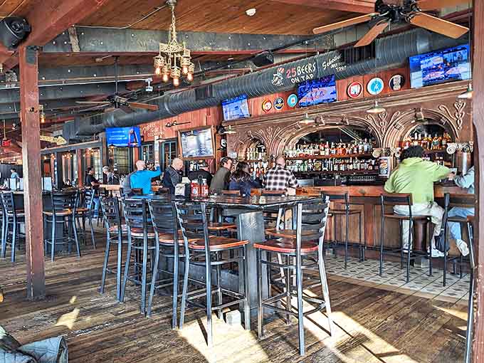 Where industrial meets inviting—exposed ductwork and wooden beams create the perfect backdrop for serious barbecue contemplation and cold beer consumption.