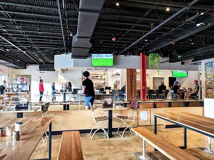 Industrial-chic meets casual comfort inside Lazy Moon, where wooden tables and exposed ceilings create the perfect canvas for pizza artistry.