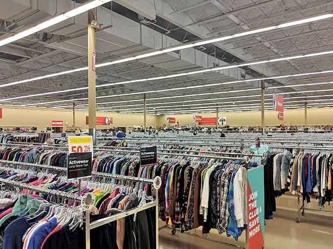 Endless racks stretch toward retail infinity, each hanger a potential jackpot that doesn't require pulling a lever or knowing when to fold.