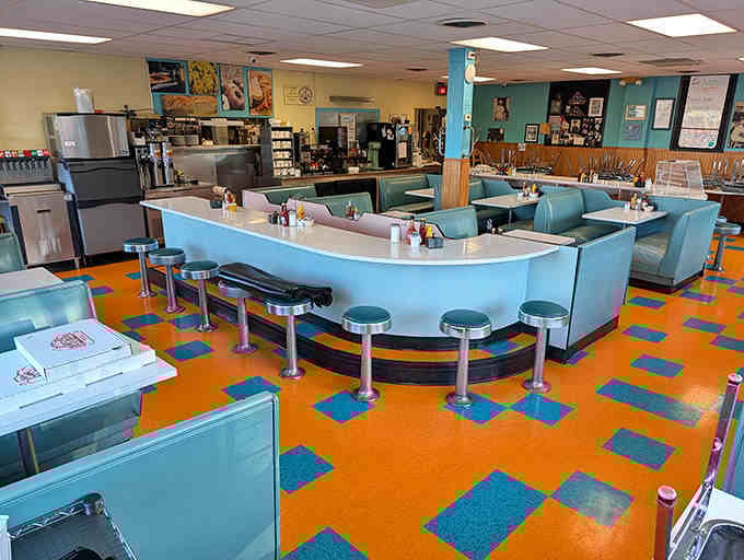 Time travel isn't science fiction at Harold's—it's that turquoise and orange checkerboard floor carrying you straight back to simpler, delicious times.