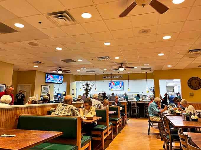 Inside, wooden booths and green vinyl seats create that perfect balance of comfort and no-nonsense practicality that defines great Southern diners.