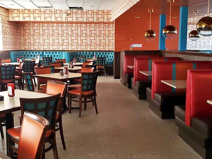 Teal booths and cherry-red banquettes create that perfect retro-modern vibe. Like stepping into a 1950s postcard that's been lovingly restored for today's comfort seekers.
