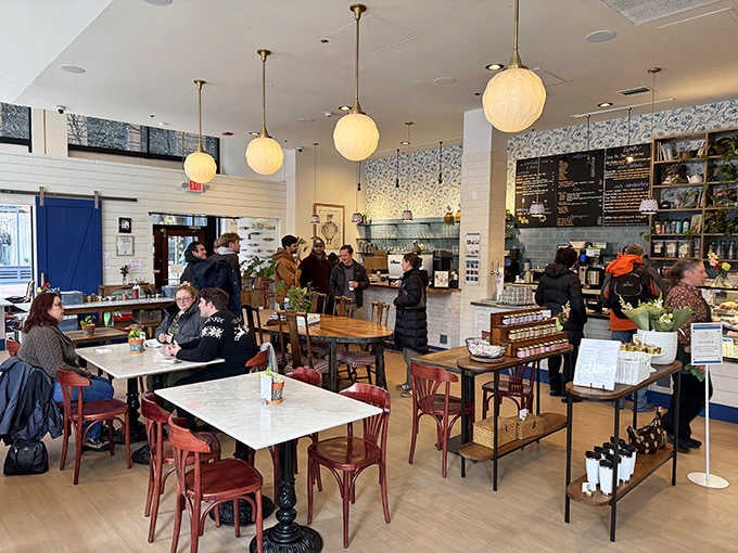 Inside Ellie's, globe pendant lights cast a warm glow over marble tables where locals gather, creating that perfect "I could stay here all day" atmosphere.