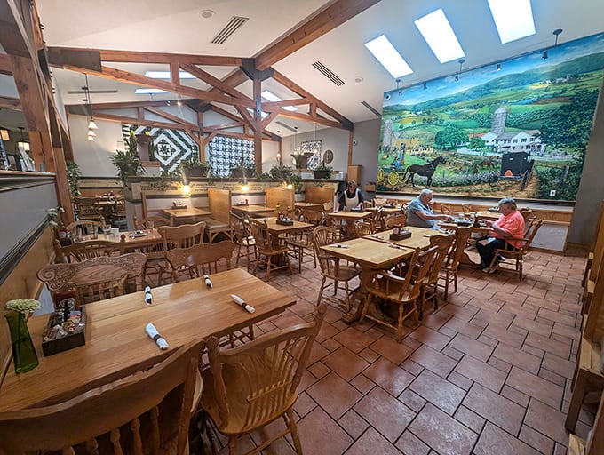 Wooden beams, natural light, and that magnificent rural mural create a dining space that feels like Pennsylvania's soul made tangible.